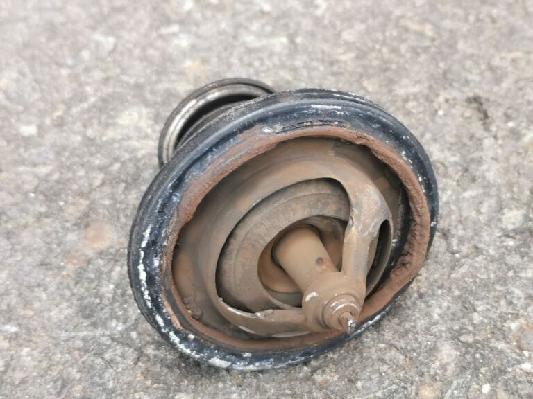 What causes a leaking radiator valve and how do I fix it?